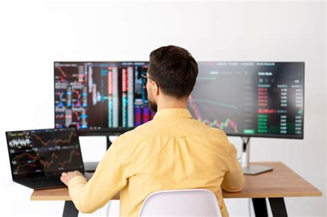Premium Photo Trader Using Laptop Working Online With Crypto Chart