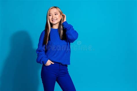 Portrait Of Young Sweet Model Chinese Woman In Blue Knitted Sweater Touching Her Dyed Beautiful