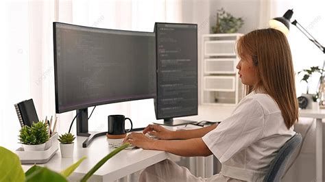 Focused Female Software Dev Works With Code In Modern Office Photo