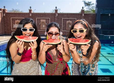 Three Beautiful Young Indian Girls Having Fun Together And Eating