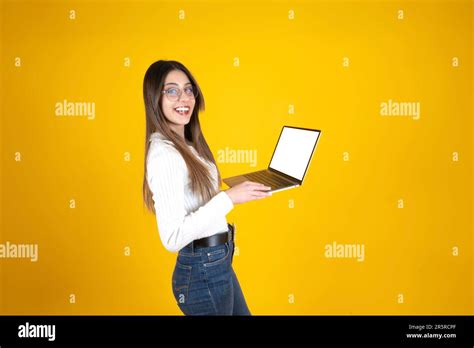Side View Portrait Of Caucasian Woman Holding Modern Laptop Isolated
