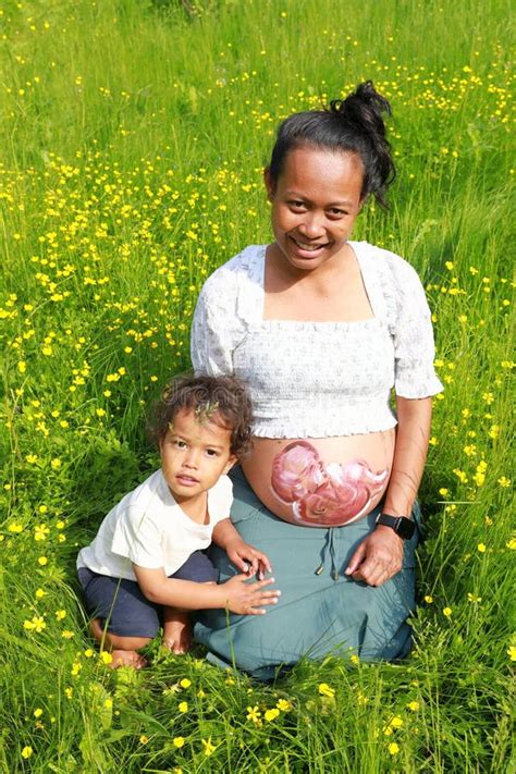 Cute Boy With His Pregnant Mom With Belly With Painted Baby Stock Photo Image Of Dressed