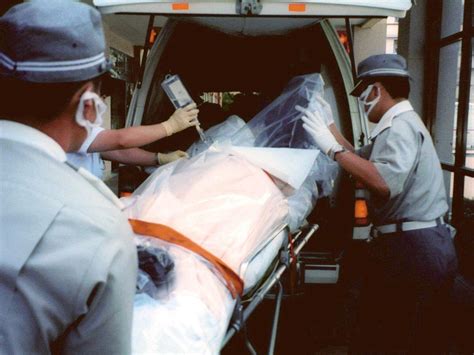 A Photo Of A Plastic Wrapped Hisashi Ouchi Being Transferred After The