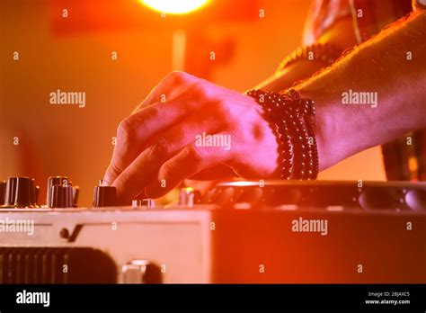 DJ Mixing Tracks On A Mixer In A Nightclub Stock Photo Alamy