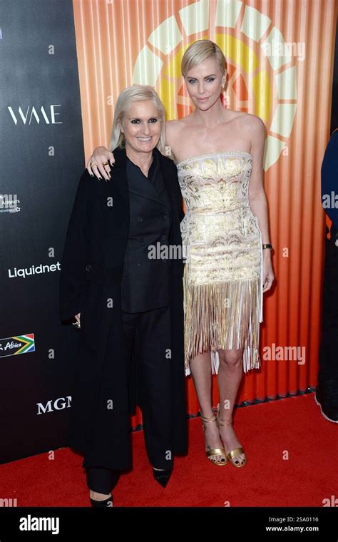 Maria Grazia Chiuri And Charlize Theron Attending Charlize Therons Africa Outreach Project