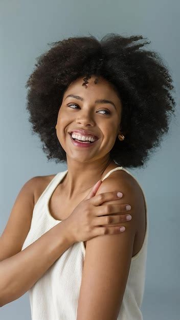 Premium Photo Smiling Woman Touching Her Shoulder