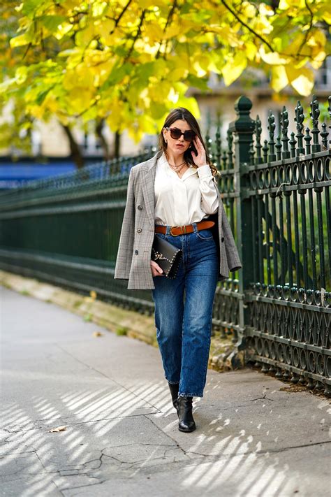 Jeans anchos con botas altas la combinación que te evita errores Vogue