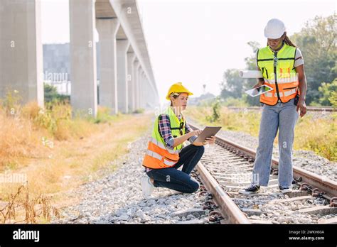 Engineer Female Railway Tracks Service Team Working On Site Survey Check Maintenance Inspection