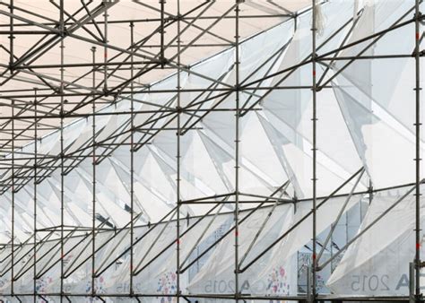 MMX Uses Scaffolding To Build A Cluster Of Origami Like Pavilions