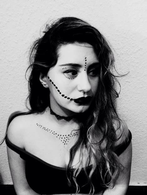 Premium Photo Young Woman With Make Up Against Wall