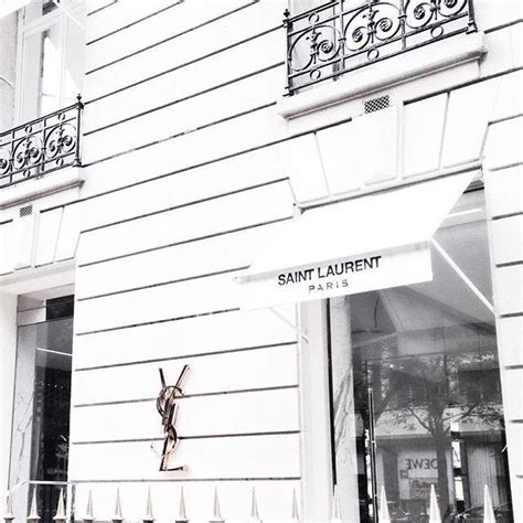 Saint Laurent Paris Storefront With Antman Statue