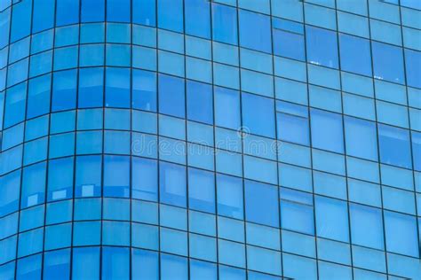 Modern Office Building Wall Made Of Blue Glass And Steel Frame Stock