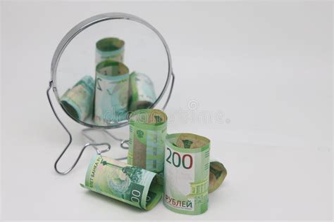 Rolled Banknotes Are Reflected In The Mirror Doubling Illusion Falling Income Concept Of