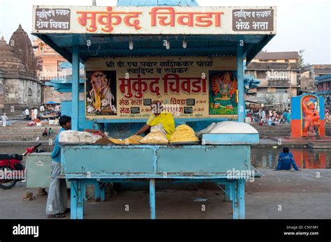 Street Vendor Sells Indian Food Off A Street Stall Photographed In