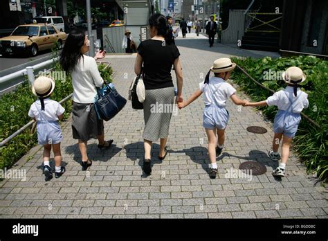 Girls With Their Mother On Their Way To School Tokyo Japan Asia