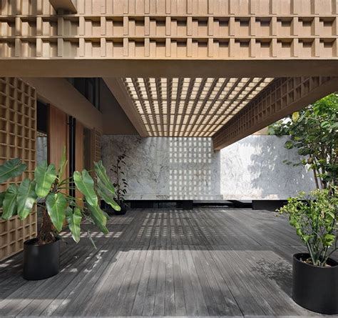 Perforated Grid Facade Skin Enfolds Private Retreat In Indonesia Roof