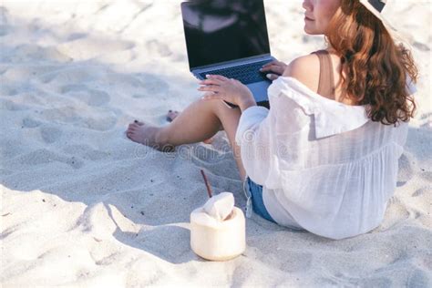 a woman using and typing on laptop computer stock image image of