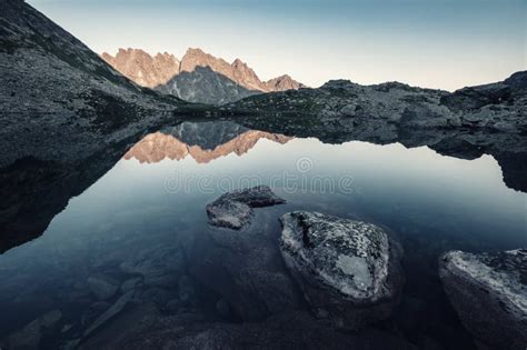 Mountain Peaks Reflected In Water Stock Photo Image Of Outdoor Lake