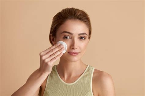 Premium Photo Woman Cleaning Face With White Pad Beautiful Girl