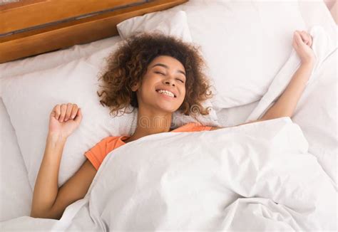 Happy Girl Waking Up And Stretching In The Morning Stock Image Image