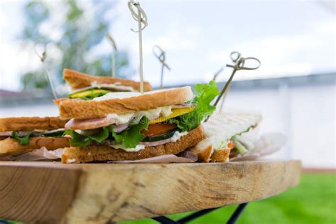 Triangular Shaped Sandwich With Ham Vegetables And Mayonnaise On A