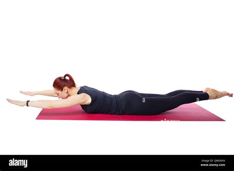 Pilates Or Yoga A Slender Athletic Girl Performs An Exercise To