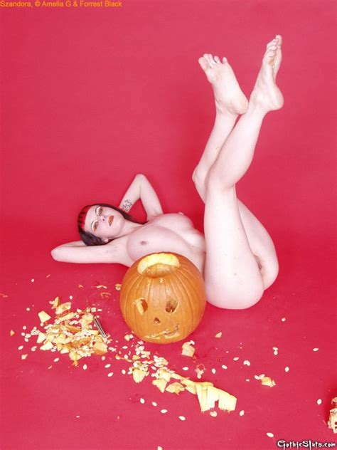 Naked Babe Szandora Poses With A Carved Pumpkin Photos