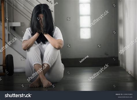 Girl Sitting Down Crying