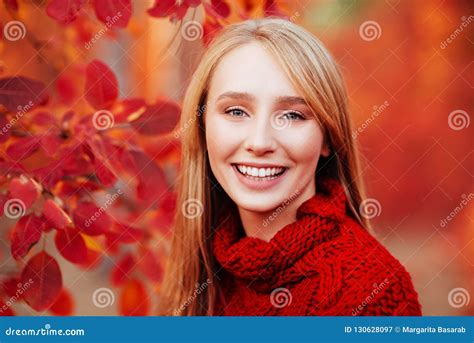 Close Up Portrait Of A Beautiful Girl Near Colorful Autumn Leaves