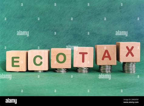 Ecotax Or Ecological And Environmental Tax Concept Word In Wooden