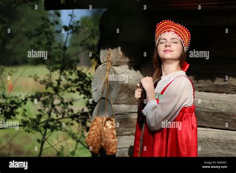 Cute Pretty Girl In A Traditional Slavic Dress On Nature In An Unspoilt