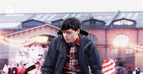 Man Sitting On A Bleacher Photo Free Boy Image On Unsplash