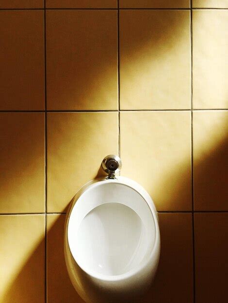 Premium Photo Urinal In Bathroom