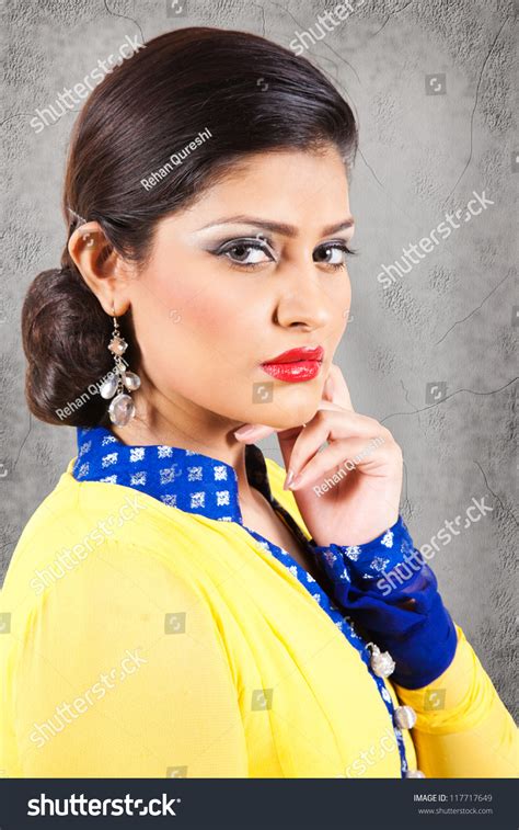 Beautiful Indian Female Fashion Model Wearing Jewellery Posing Against