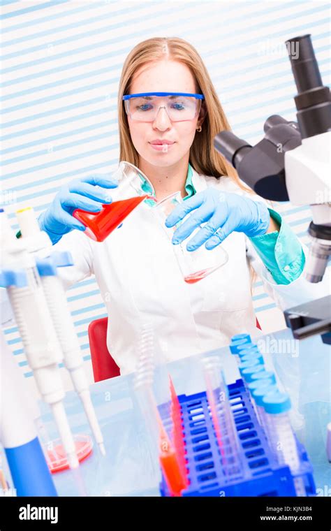 A Female Lab Assistant Doing Scientific Experiments In A Scientific Laboratory Stock Photo Alamy