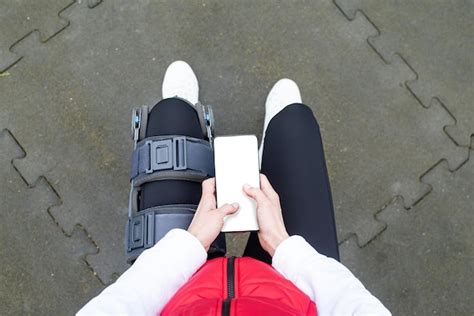 Premium Photo Woman Wearing Knee Brace Or Orthosis After Leg Surgery
