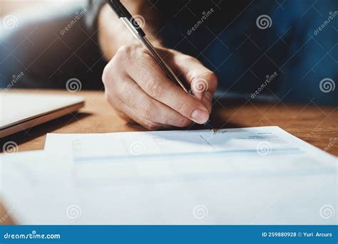 Sealing The Deal An Unrecognizable Businessman Signing Paperwork In