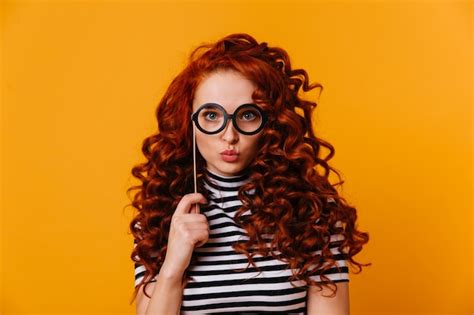 Free Photo Blue Eyed Red Haired Woman In Striped T Shirt Blows Kiss
