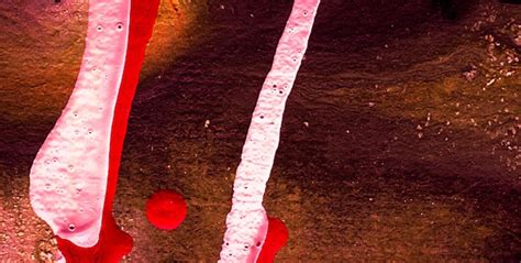 Premium Photo A Red Line Is Drawn On A Black Surface With Red Spots