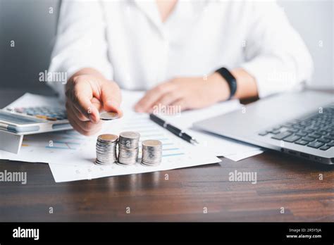 Saving Money Concept Preset By Female Hand Putting Money Coin Stack