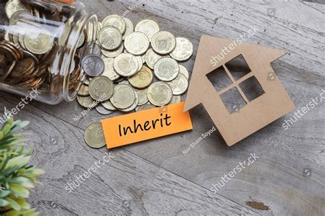 Inherit Message Written On The Post Note With A House Model From