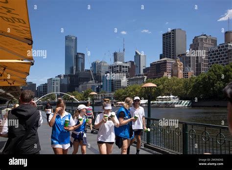 Students Enjoying A Walk Along The River Yarra In Melbourne City