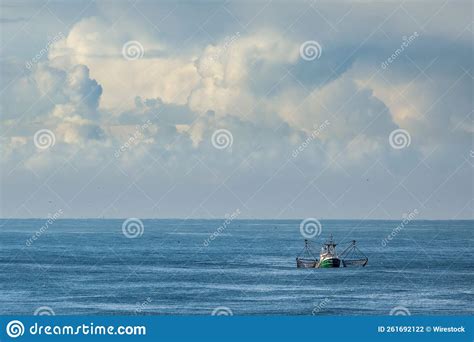 A Cutter With Lifted Drag Nets On The Blue Water Of The North Sea Editorial Photography Image