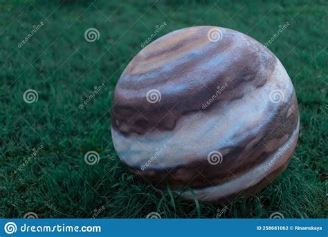 Jupiter Planet Model On Green Grass Science Astronomy Concept Stock