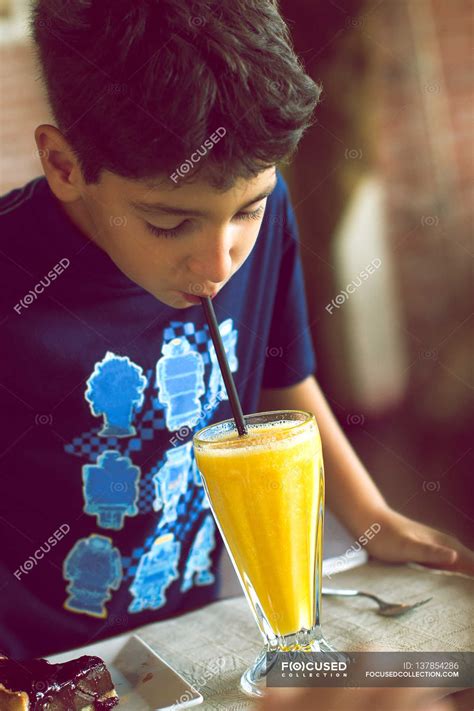 Boy Drinking Orange Juice Food And Drink Hot Stock Photo