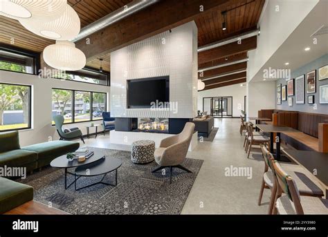 Fireplace And Seating Area In Community Room Of Apartment Comple Hi Res