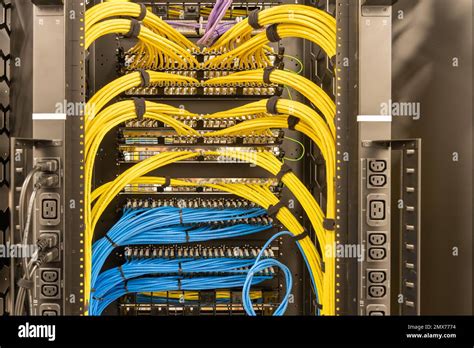 Rack With Power Sockets On A Side Multiple Switches And Routers With
