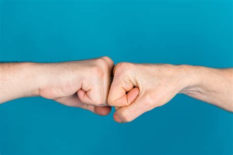 Photo Of Two Mature Young People Arms Palms Hands Touching Fists Having