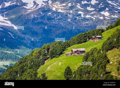 Snowcapped Mountains In Stelvio National Park With Farms Valfurva