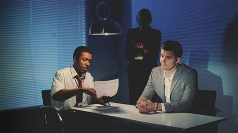 Suspect Being Interviewed By A Police Detective Free Stock Video